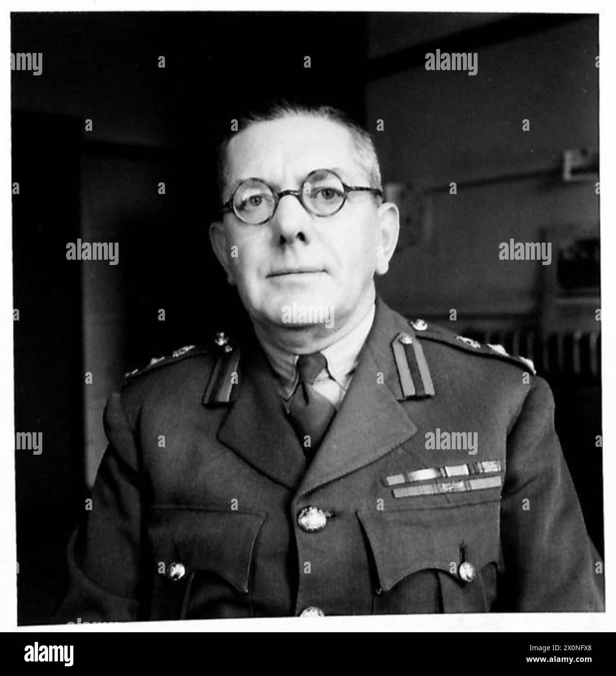 Colonel C.P.D. Ward of the 9th Anti-Aircraft Group is photographed in ...