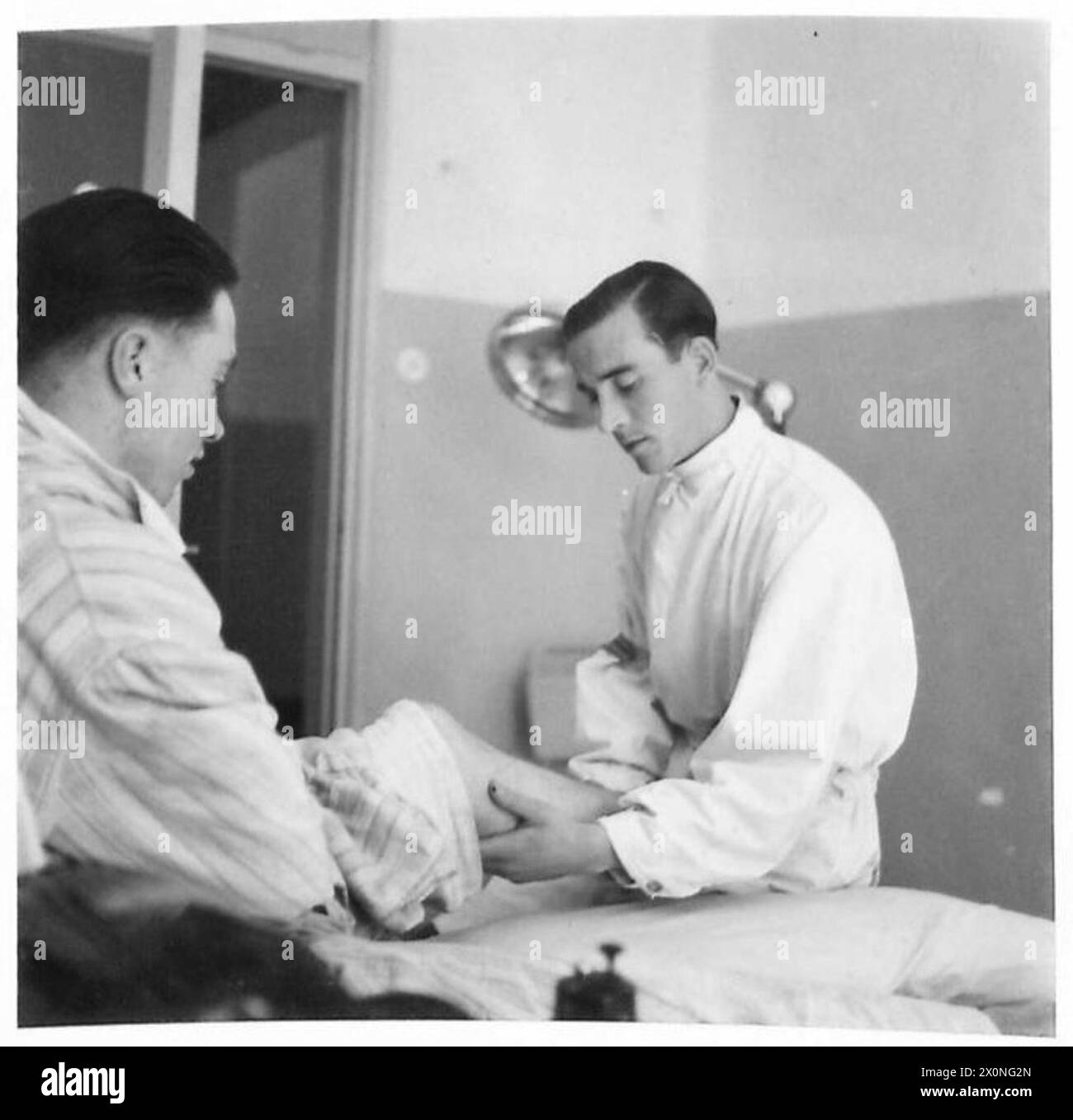 Medical personnel provide limb massage for healing wounds among British ...