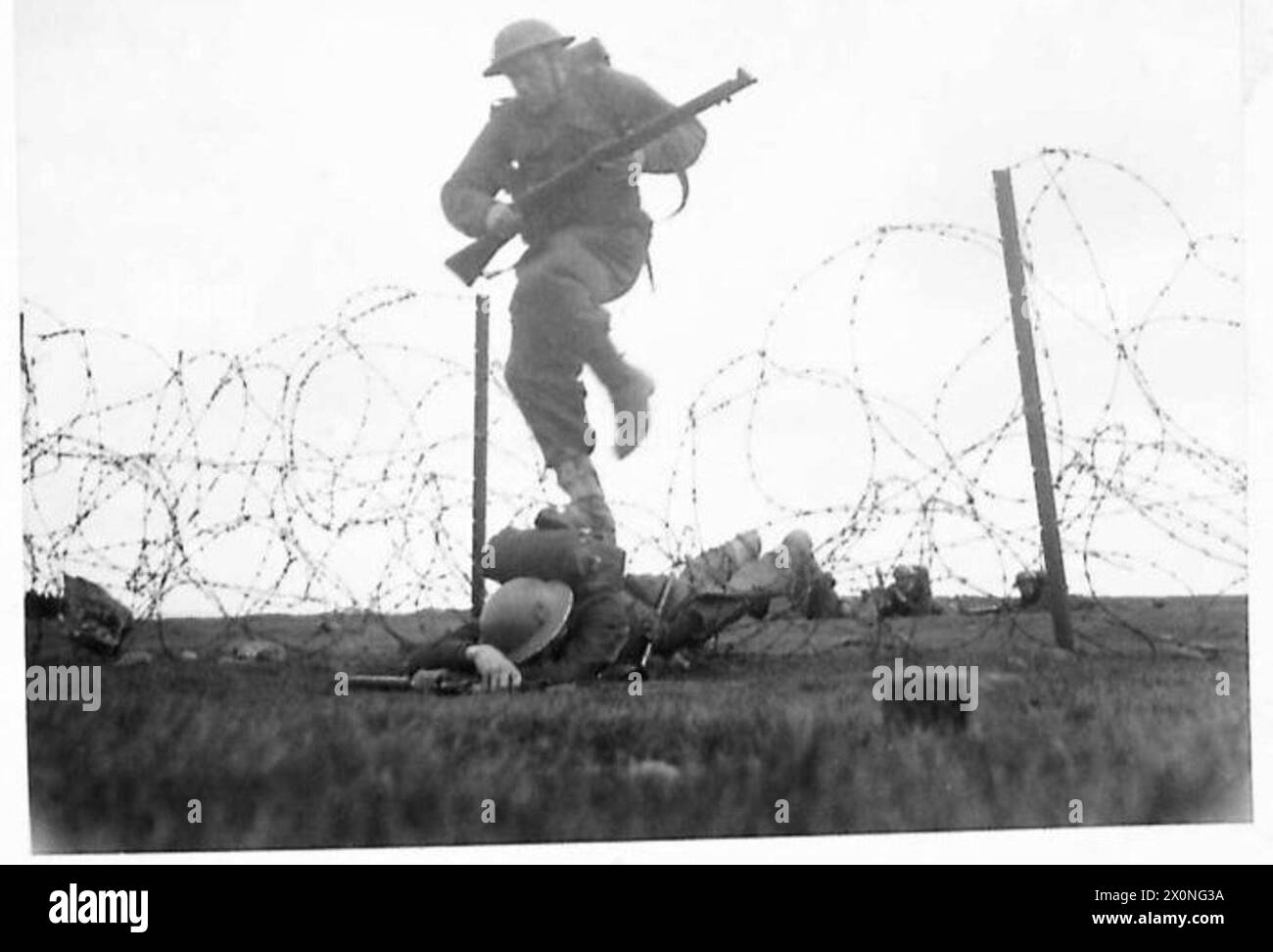 Soldiers demonstrate the correct method of overcoming Dannet wire ...