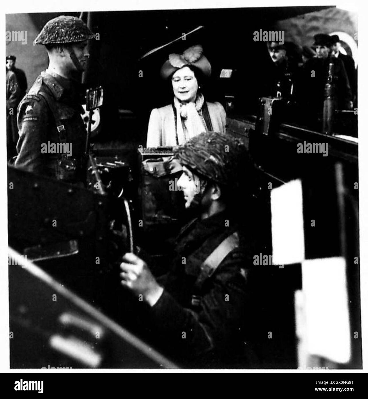 The Queen inspects a transportable military vehicle during a review of ...