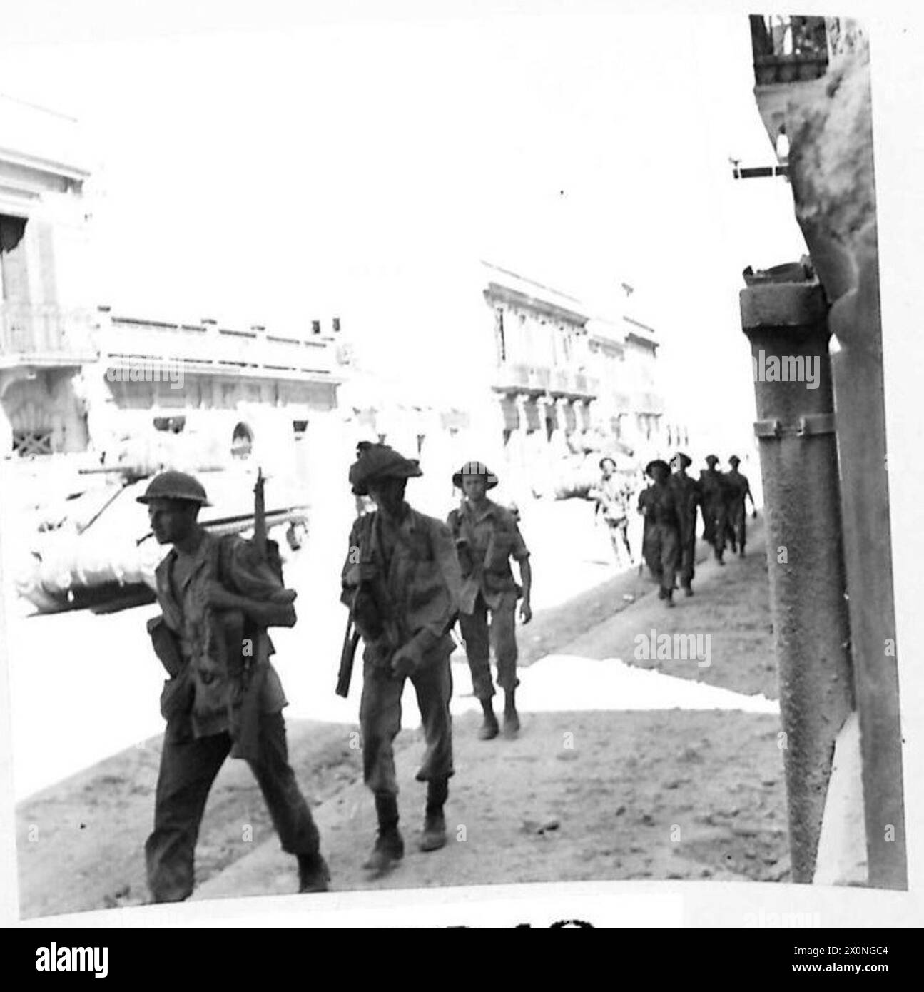 INVASION OF ITALY - Canadian Infantry marching through Reggio to take ...