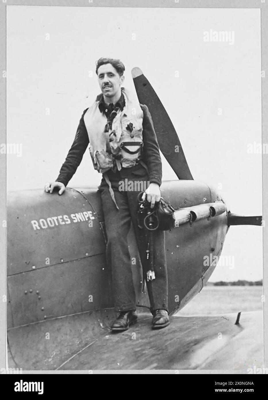 Sergeant E. Artus of London with aircraft 'Rootes Snipe', part of the ...