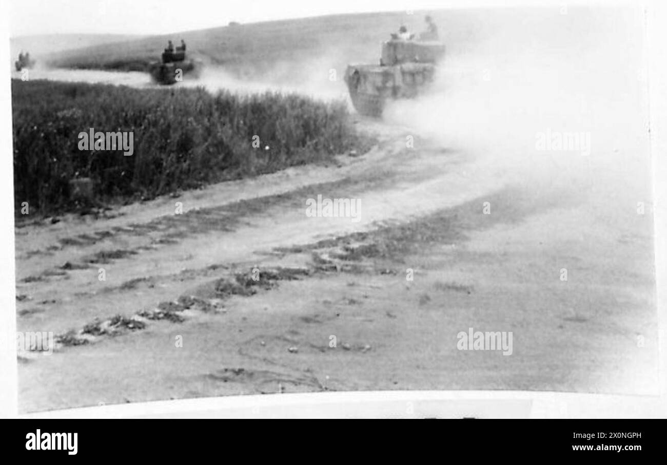 WITH THE FIRST ARMY (VARIOUS) - Churchill tanks leaving a tank harbour ...