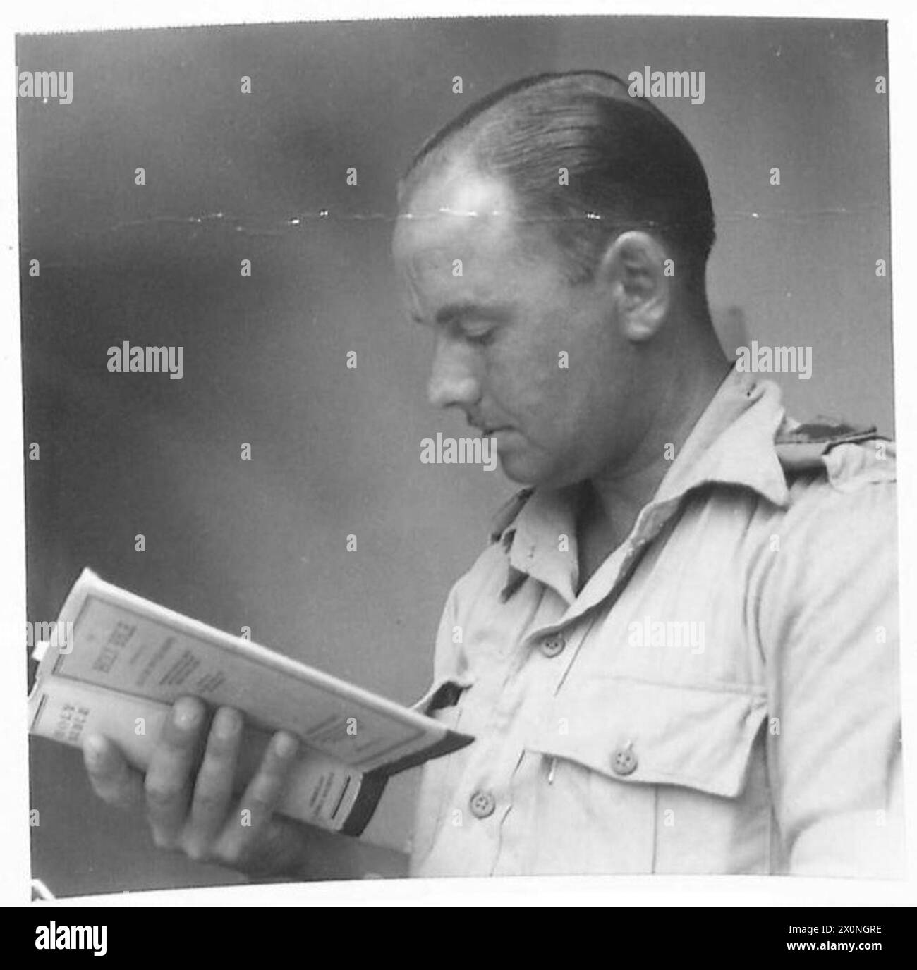 Gunner P. Collins of the 65th Field Regiment, a former boot and shoe ...