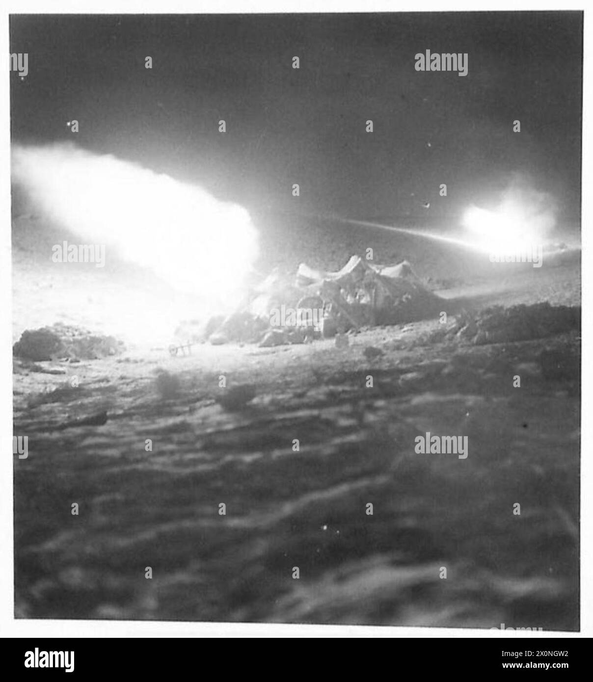 A 60-pounder gun of the Surrey and Sussex Yeomanry Regiment is firing ...