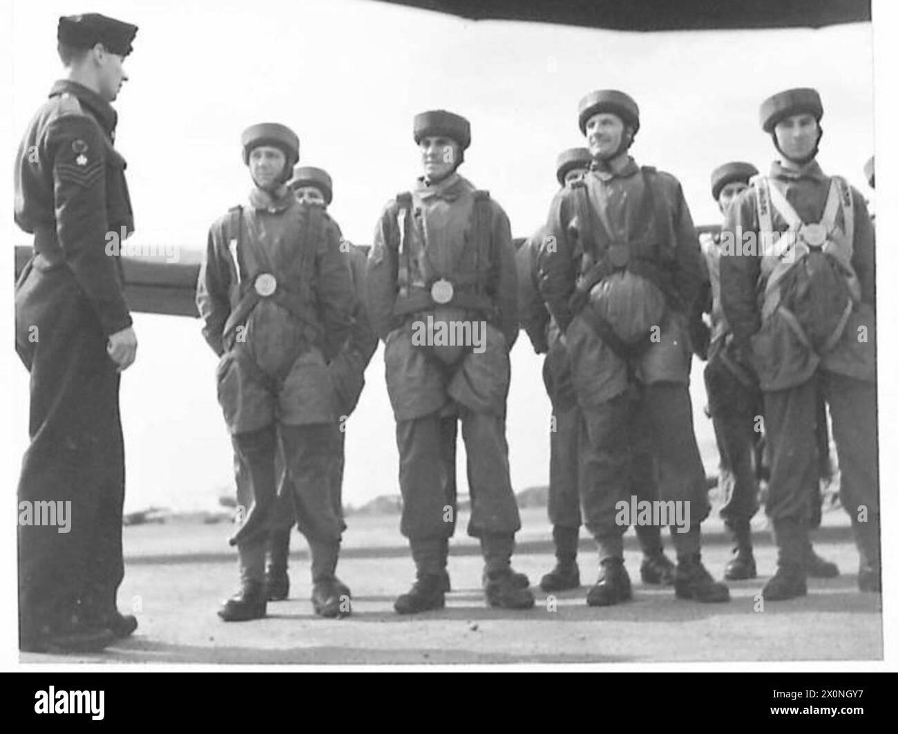 PARATROOPS IN TRAINING - A final inspection of parachute harness by RAF ...
