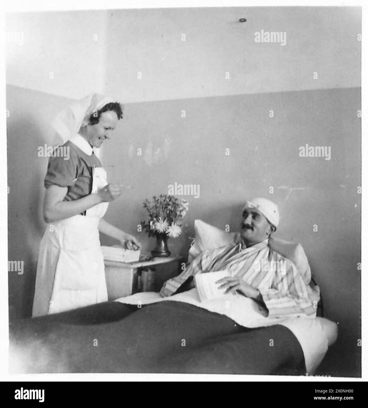 A wounded Italian officer has his temperature checked by a nurse named ...