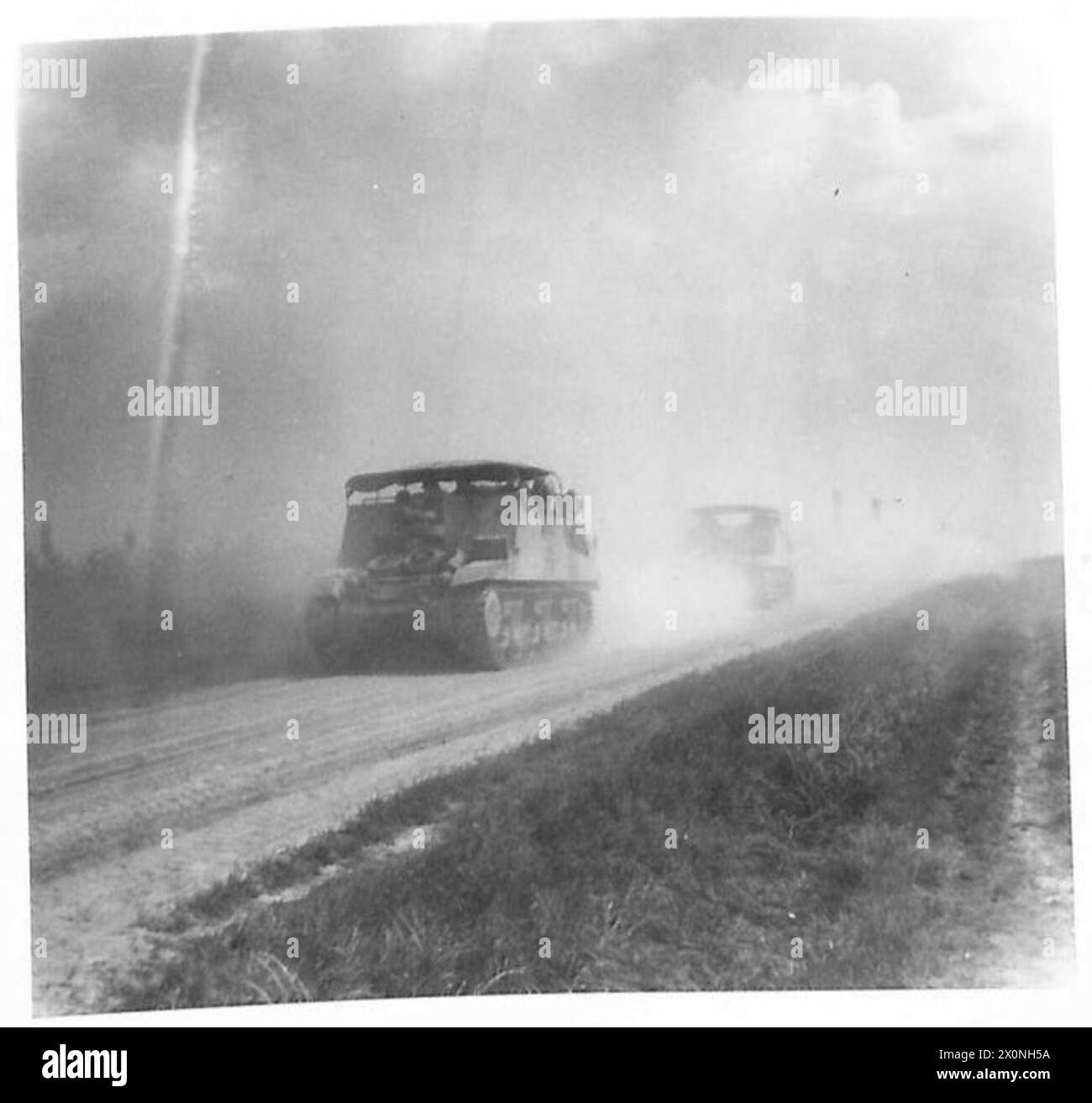 Armoured vehicles of the Eighth Army advance along dusty roads during ...