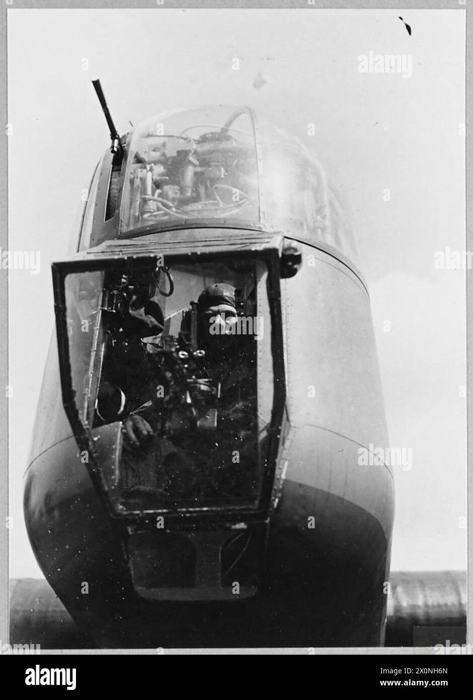 Photograph showing a Whitley bomber squadron in England with the bomb ...