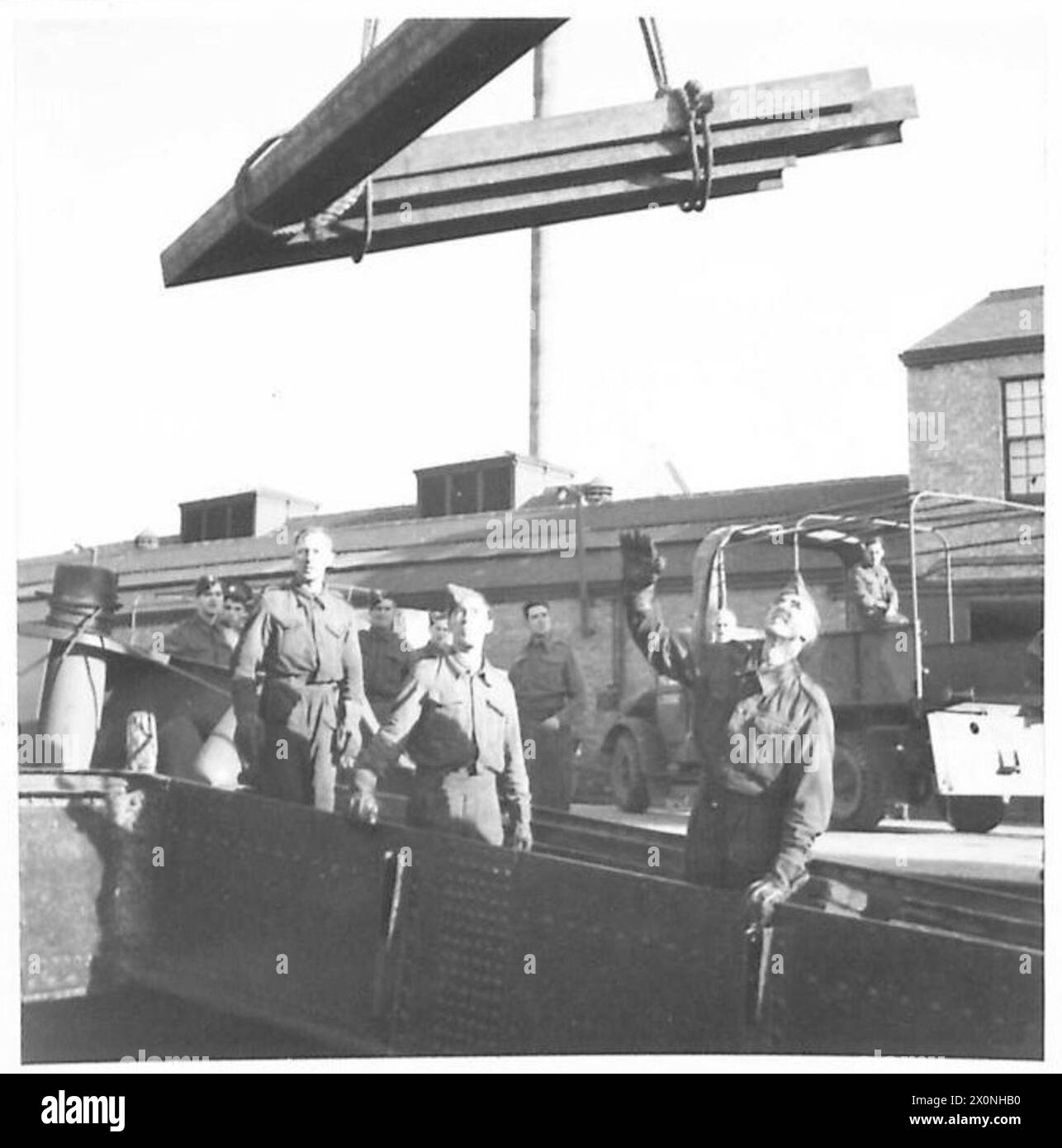 Photograph of British Army personnel loading metal angles for ...
