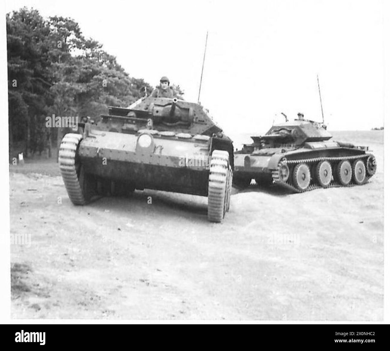 BUMPER EXERCISE - Two "Covenanters" moving from the wood in which they ...
