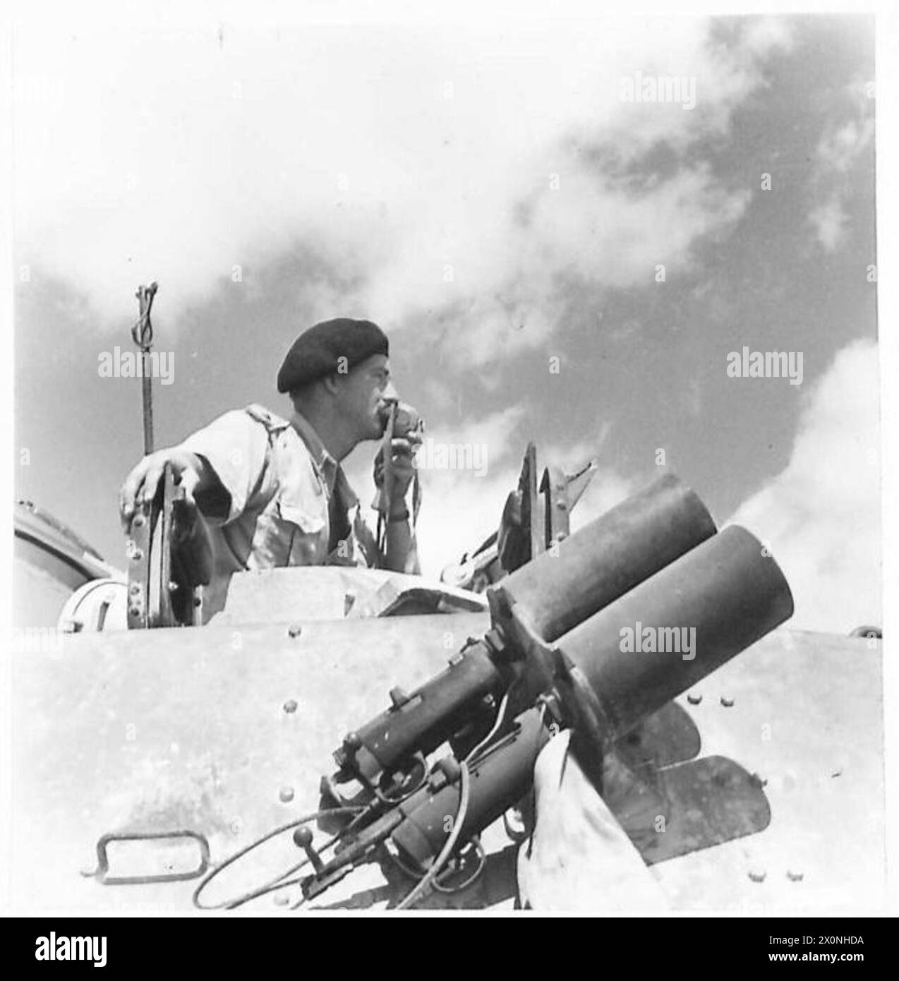 WITH THE TANKS IN THE WESTERN DESERT - A tank squadron commander giving ...