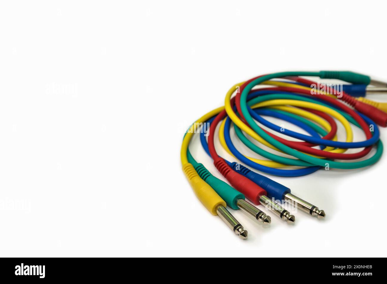 Multicolored audio cables, audio jack plug on white background ...