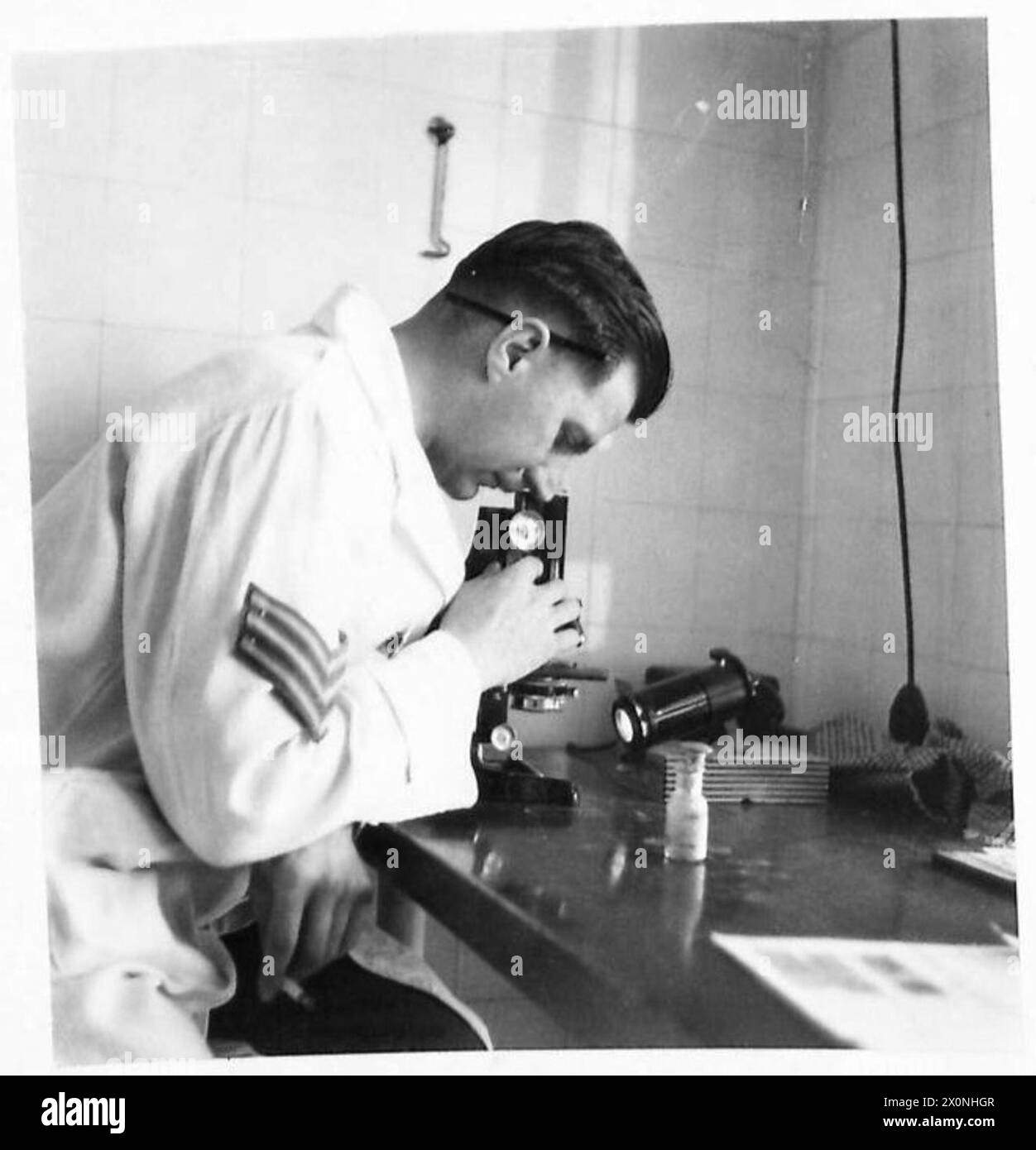 Microscope in use with a slide Black and White Stock Photos & Images ...