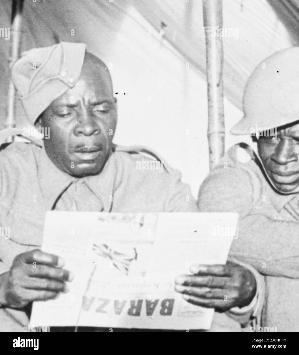 AN AFRICAN VILLAGER JOINS THE PIONEERS, 1944 - Kisarishu and other men ...