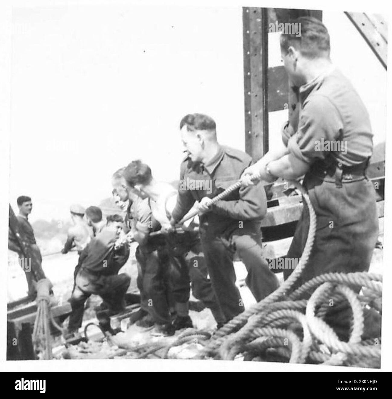 NEW TYPE OF BRIDGE UNDER CONSTRUCTION - "Manpower" R.Es pulling tackle ...