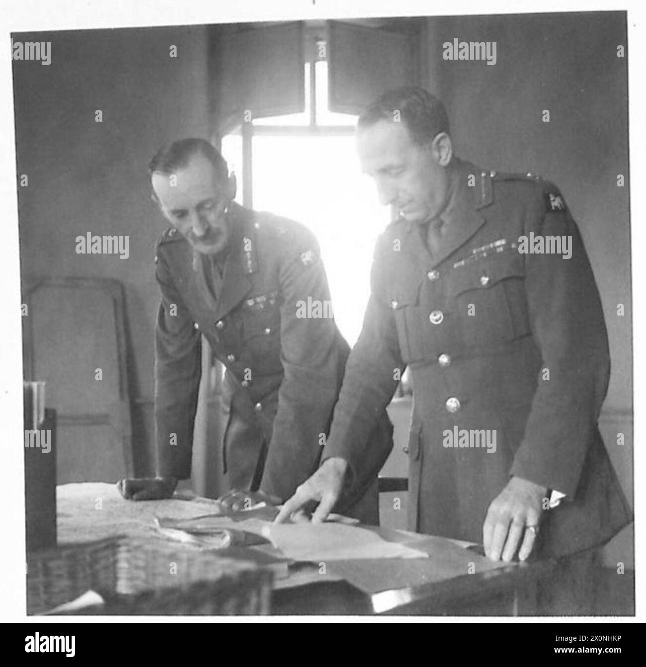 G.O.C. EASTERN COMMAND - Lieut-General L. Carr, CB., DSO., OBE., (left ...