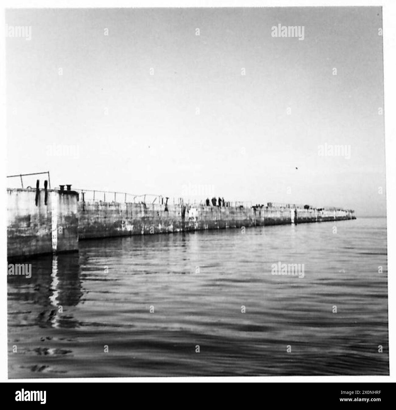 A section of the Mulberry 'B' artificial port is positioned at ...