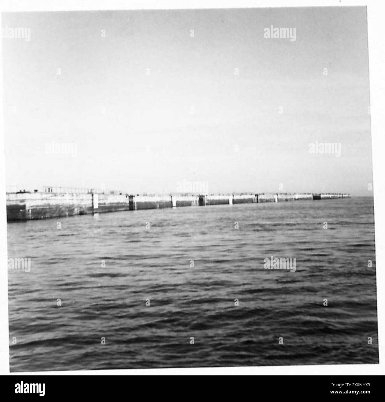 View of Mulberry B port at Arromanches from sea level showing port ...