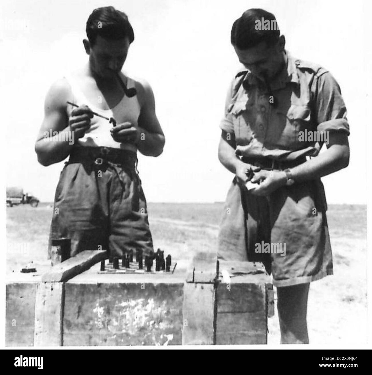 DESERT CHESS FIENDS : 8TH ARMY - Cutting the chessman out of a tin with ...