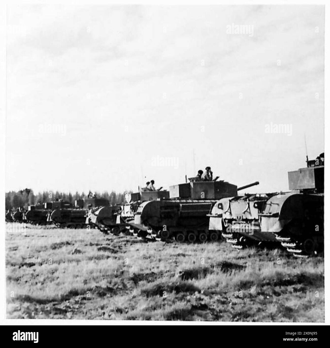A TANK BRIGADE ON PARADE - Churchill tanks drawn up on parade ...