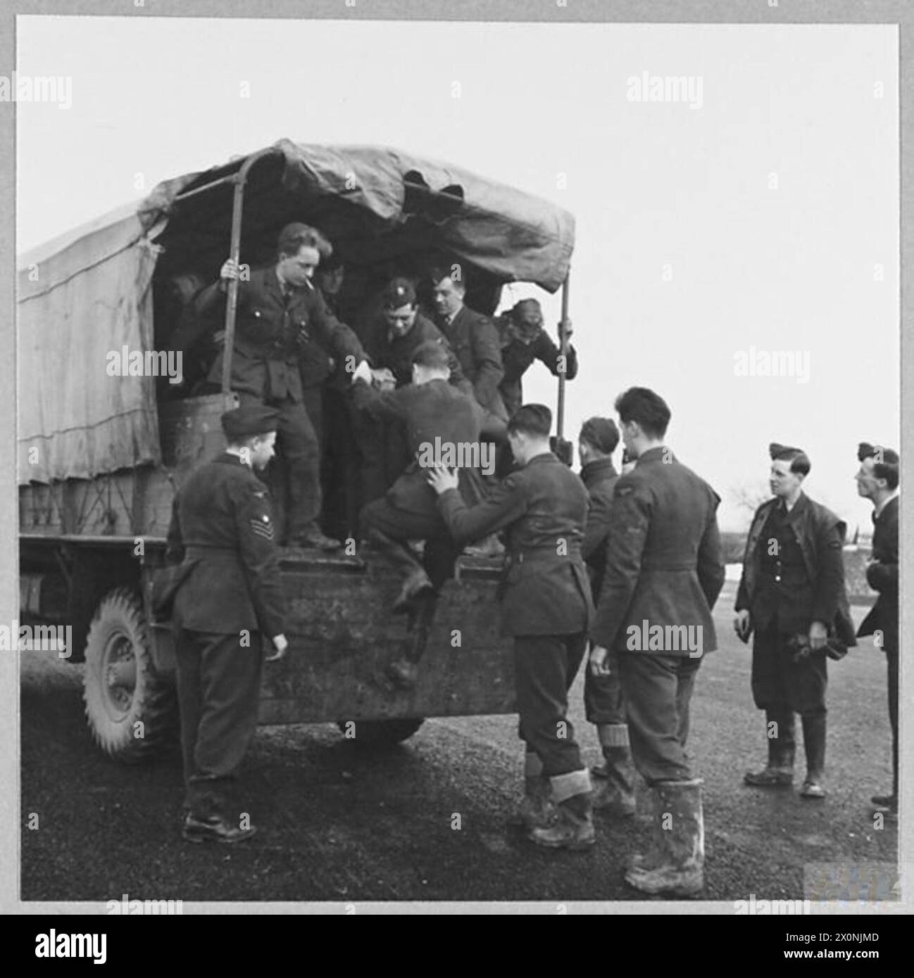 Royal Air Force recruits, known as 'Erks,' are shown boarding a lorry ...