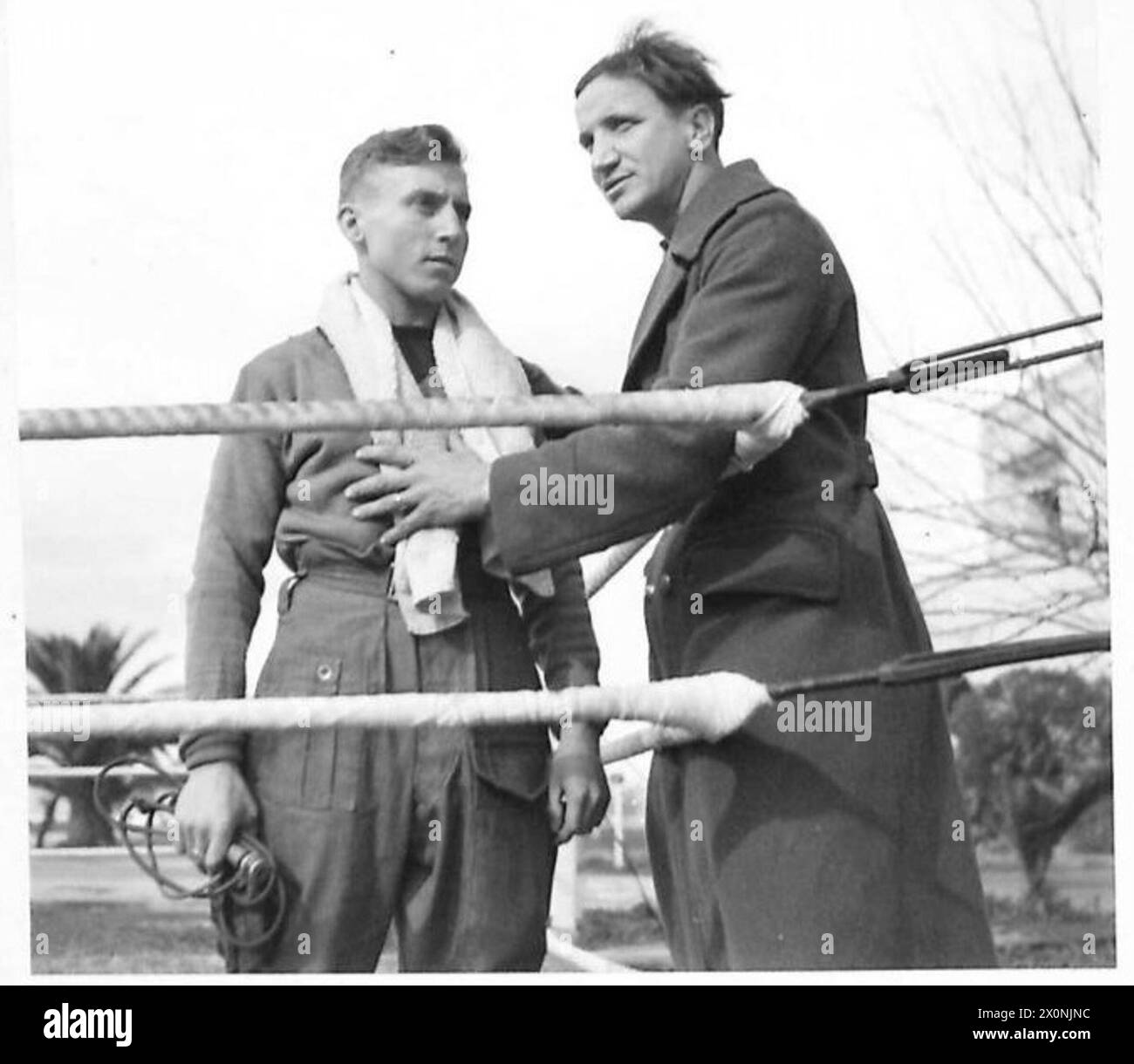 Royal Marines' Ronald Burr talks to RAF Aircraftsman Arthur Moody, in ...