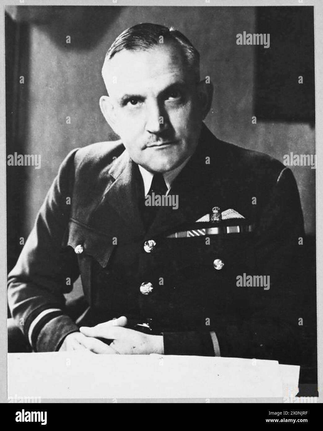 Air Commodore F.L. Hopps, CBE, AFC, is depicted in a 1943 photograph as ...