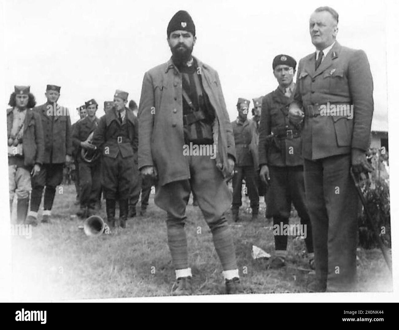 CHETNIKS HAND IN THEIR ARMS - General Momcilo Dujib addresses his men ...