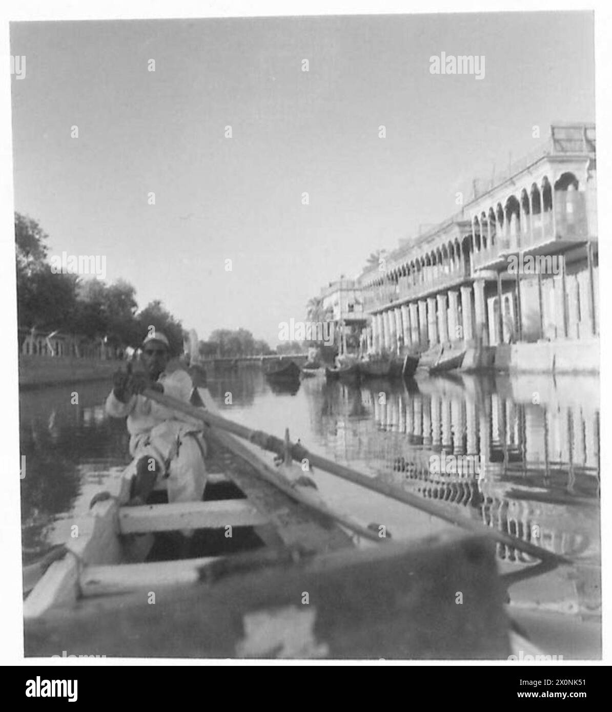 Photographs show two views of a tributary of the Shatt River flowing ...