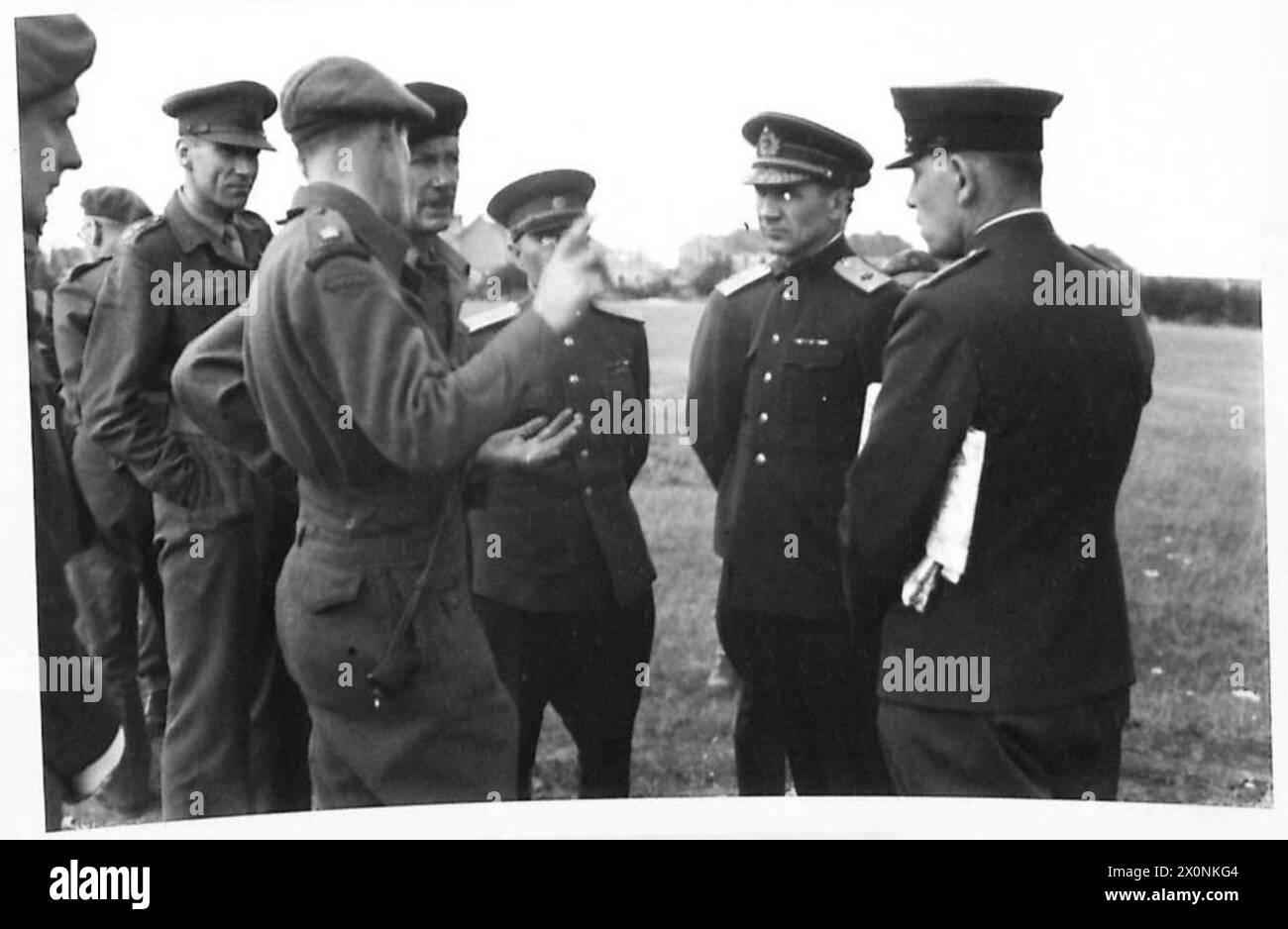 Photographic negative showing a British artillery officer demonstrating ...