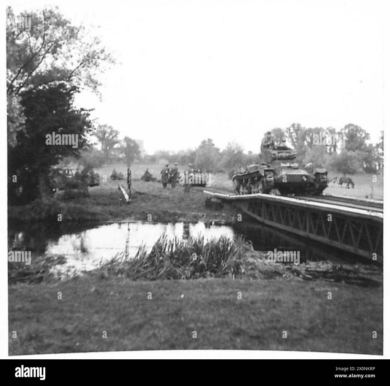 ARMOURED DIVISION CROSSING NEWLY ERECTED BRIDGES - A Valentine crossing ...