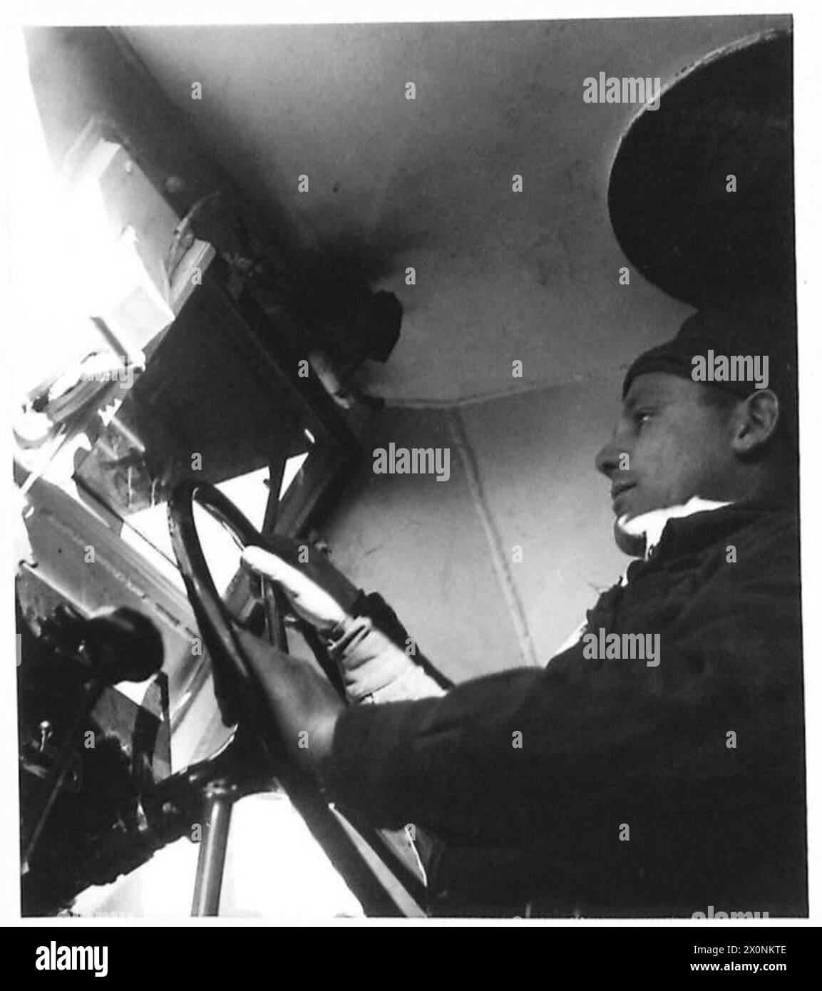 MEN OF A RECONNAISSANCE REGIMENT UNDER TRAINING - Seated at the wheel ...
