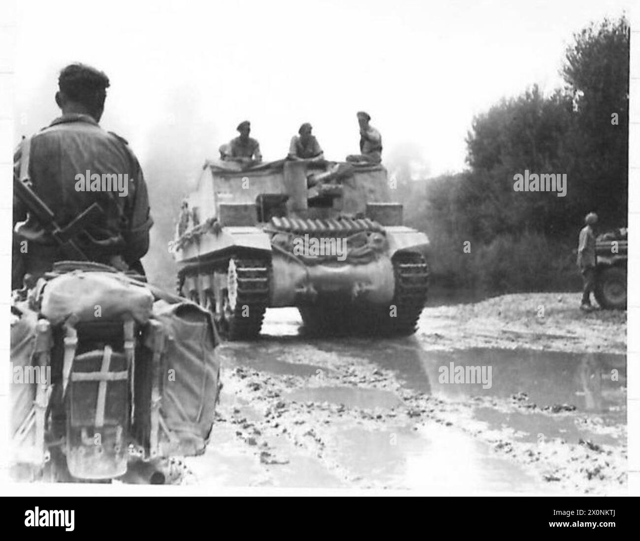 A self-propelled 25-pounder Sexton gun of the Eighth Army fords the ...