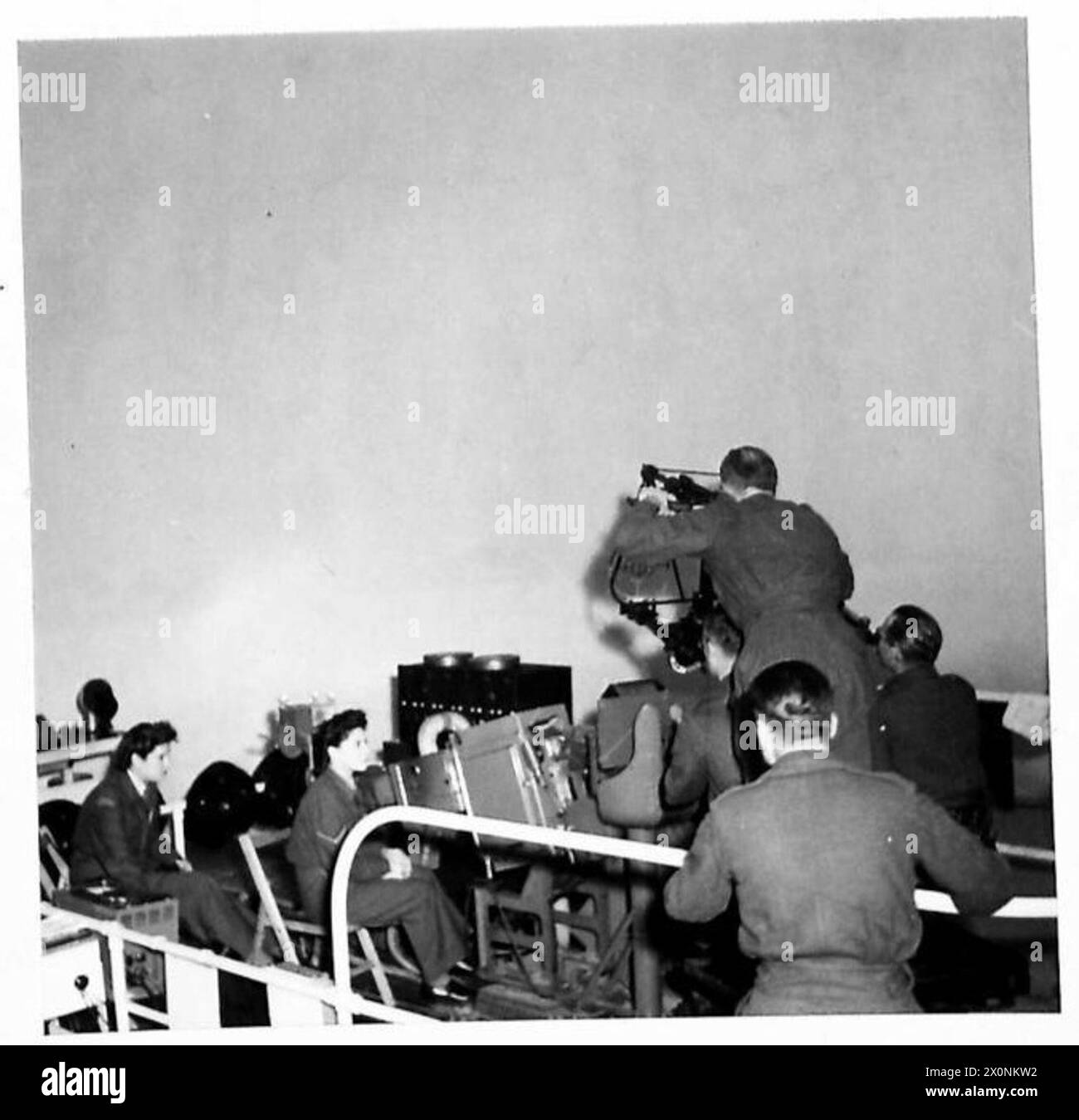 DUTCH TROOPS IN TRAINING - The dome instructor. Dummy gun follows ...