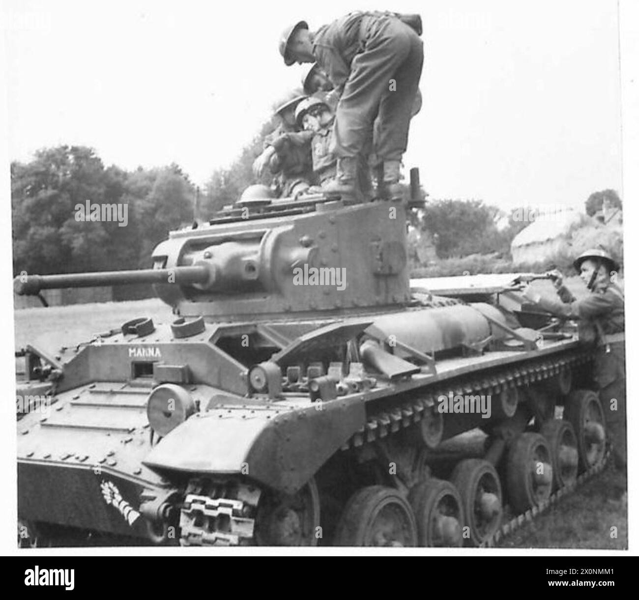 A casualty is lifted from a tank using medical procedures and equipment ...