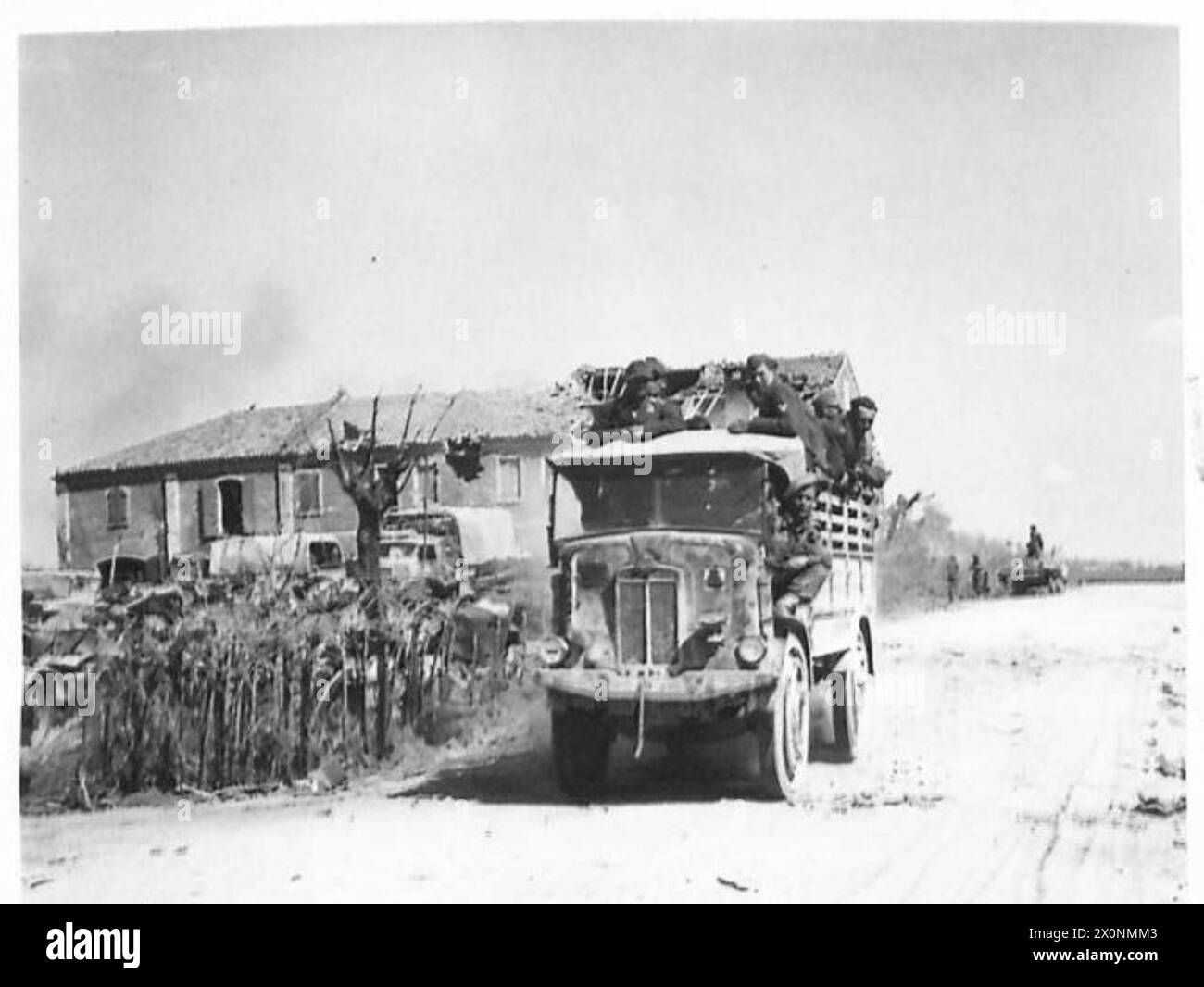 A captured German vehicle is used to transport German prisoners during ...