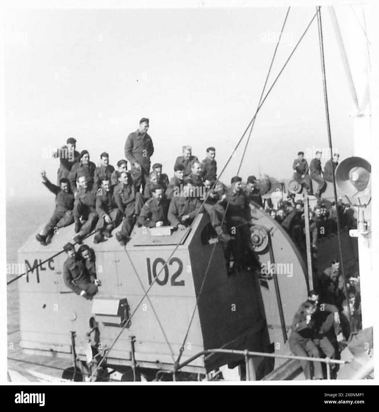 General J.H. Roberts briefs troops aboard a ship during combined ...
