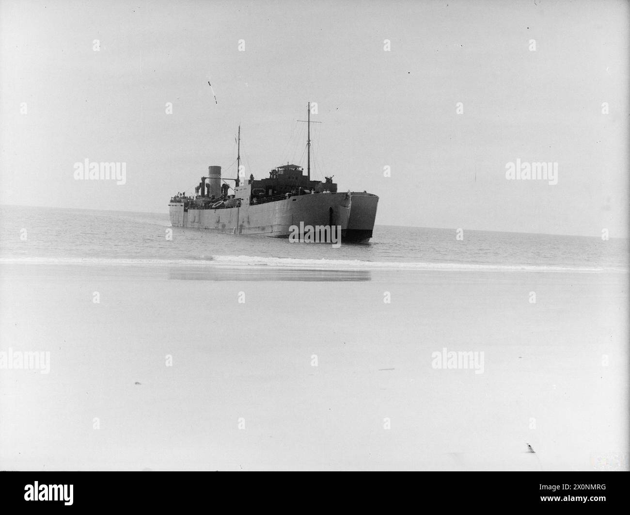 The LST Bachaquero, a converted shallow-draught tanker, is shown ...