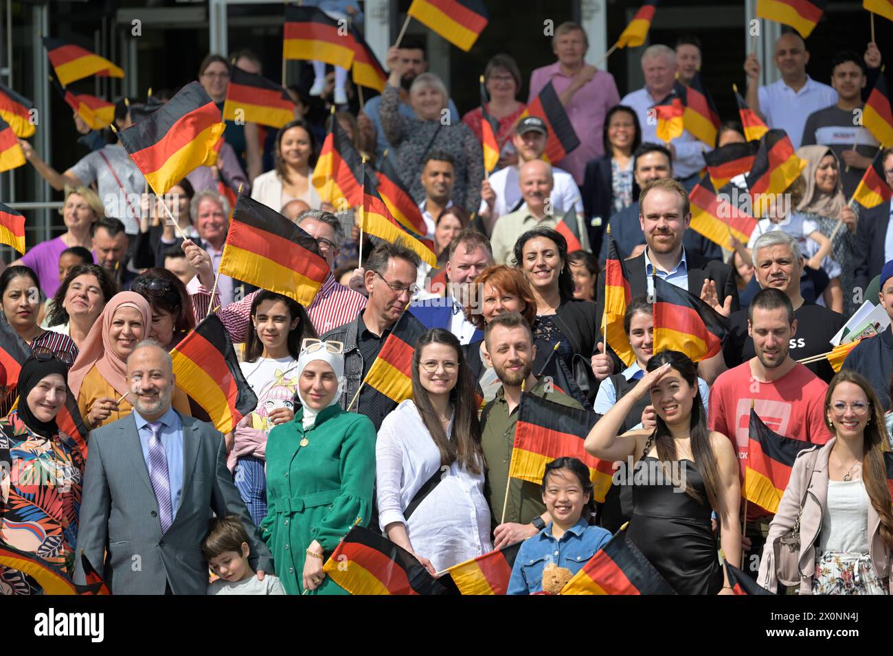 Dresden, Germany. 13th Apr, 2024. Newly naturalized persons during a group photo on the ...