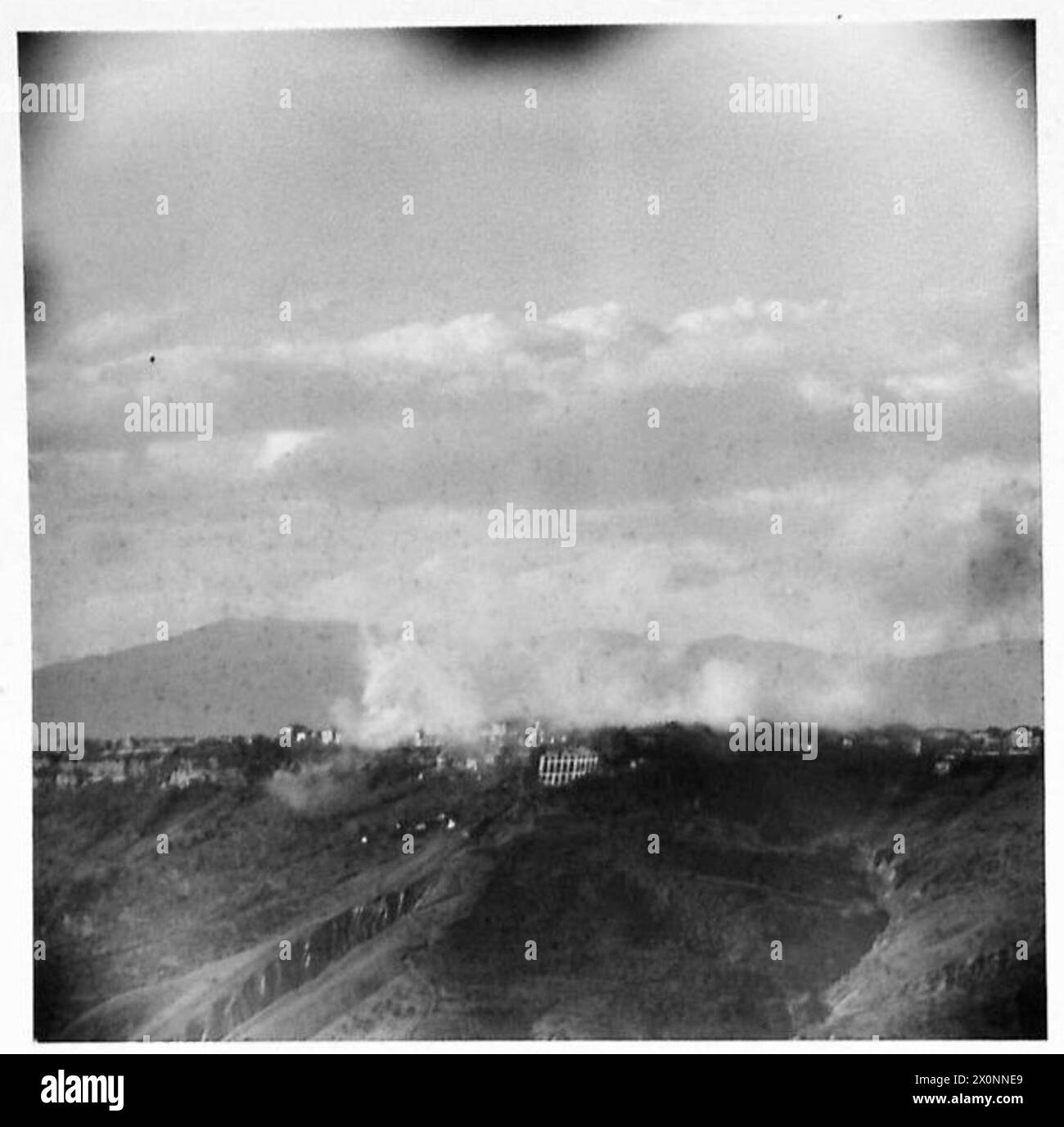 Eighth Army Kittyhawk aircraft conduct dive-bombing raids on fortified ...