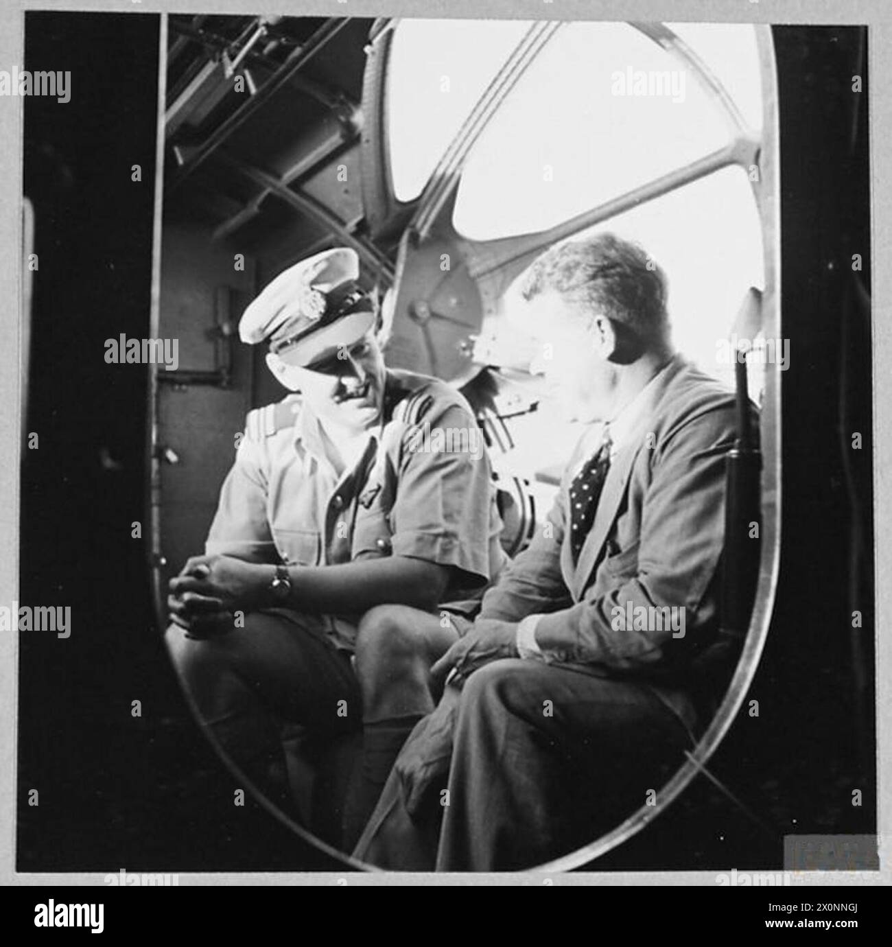 Captain Allan McMesters, a Qantas pilot, is shown interacting with a ...