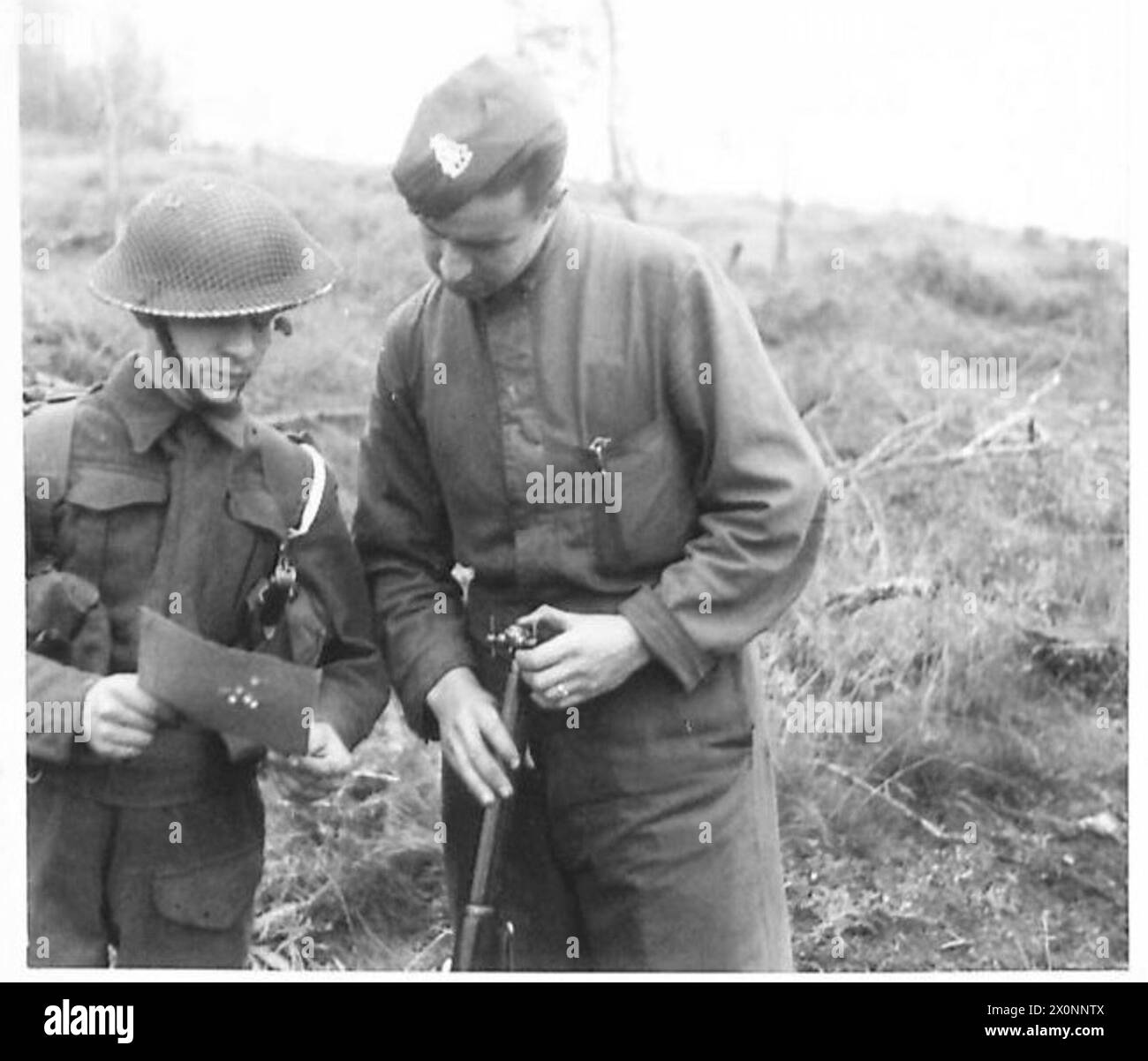 An Armourer Sergeant adjusts a rifle to correct aim during marksmanship ...