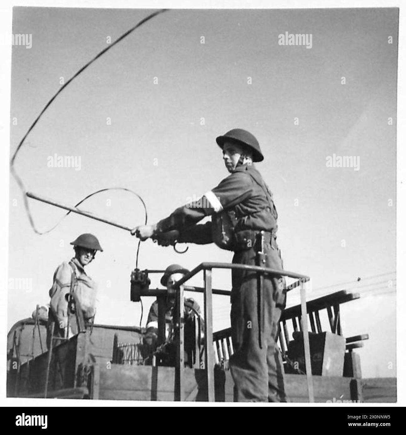 ROYAL CORPS OF SIGNALS - A cable detachment laying from a layer. Lines ...