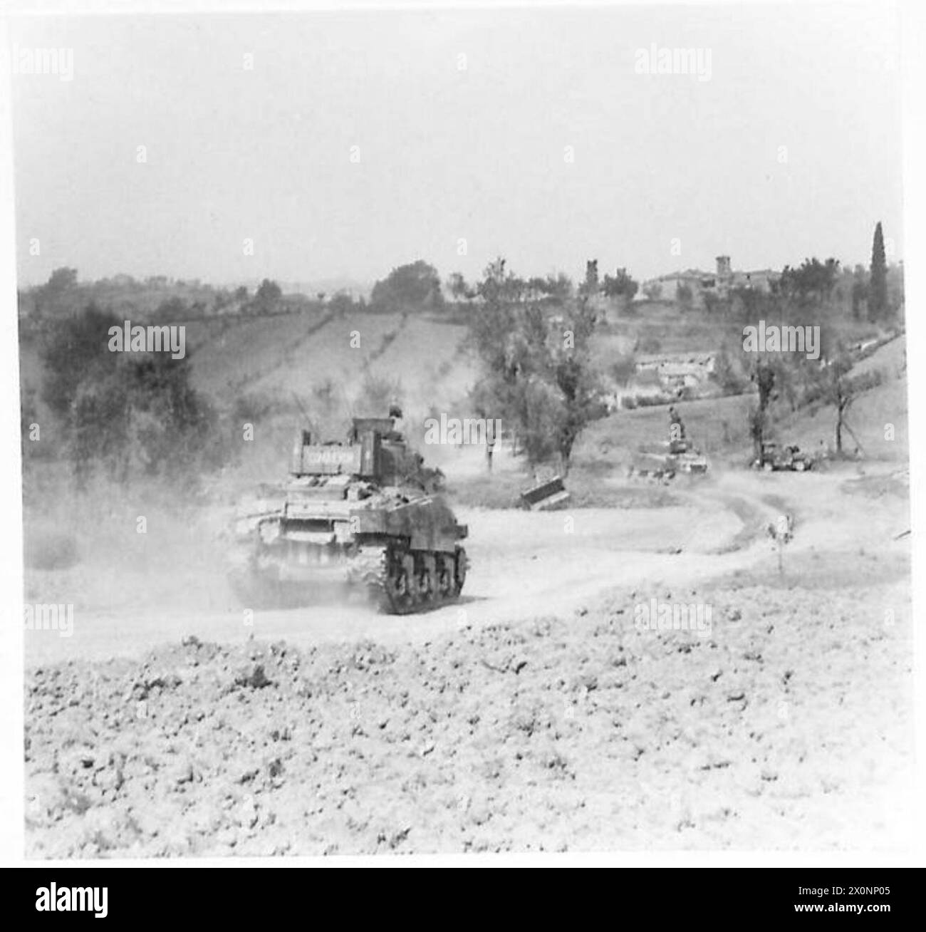Sherman tanks of the Eighth Army pass over the dry river bed of the ...