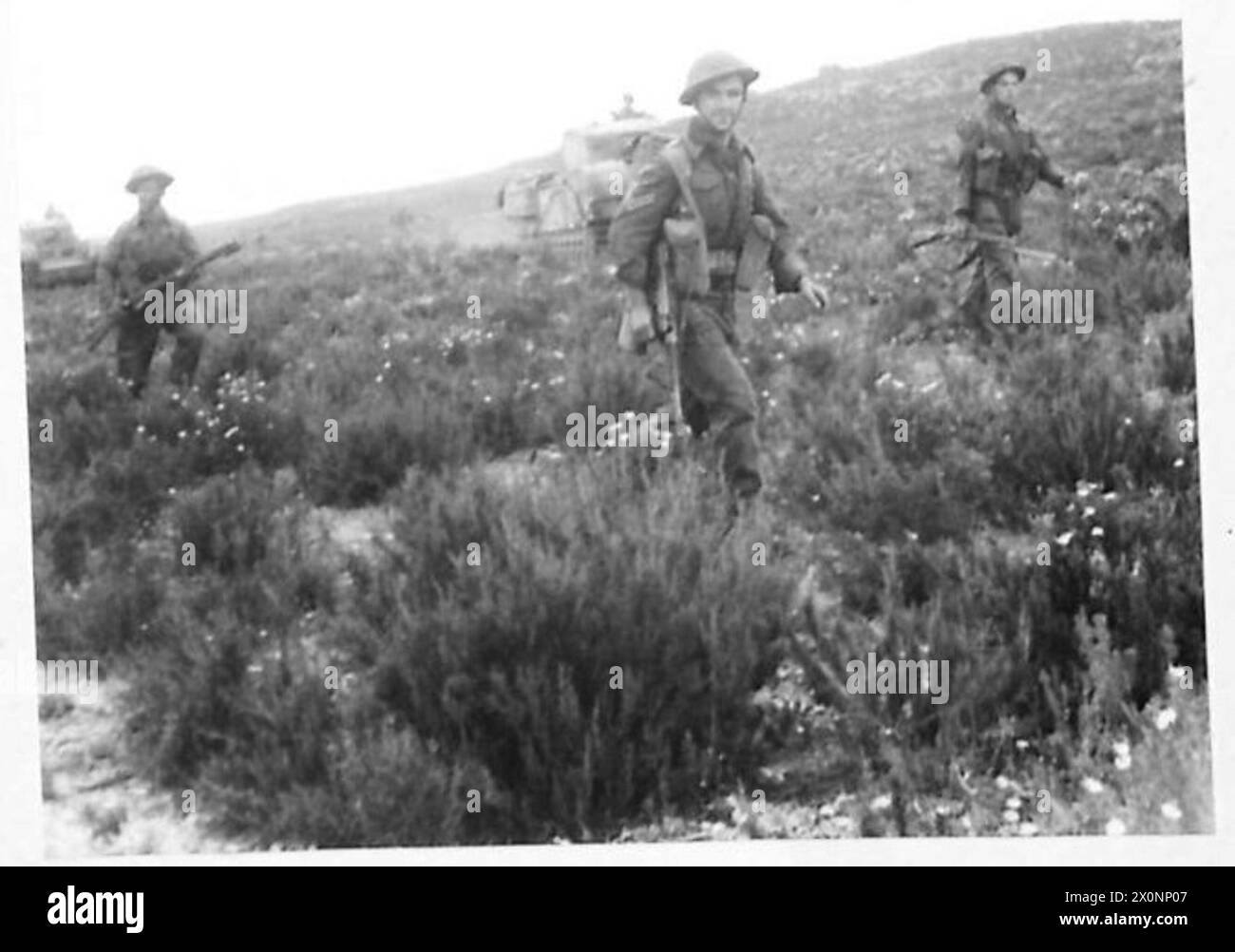 Infantry advance behind the first wave of tanks during First Army ...