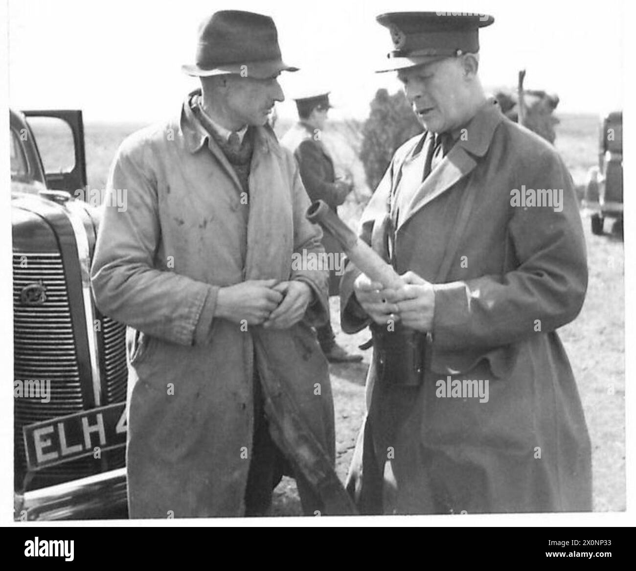 Lord Gort inspects an artillery range while a farmer shows him a German ...