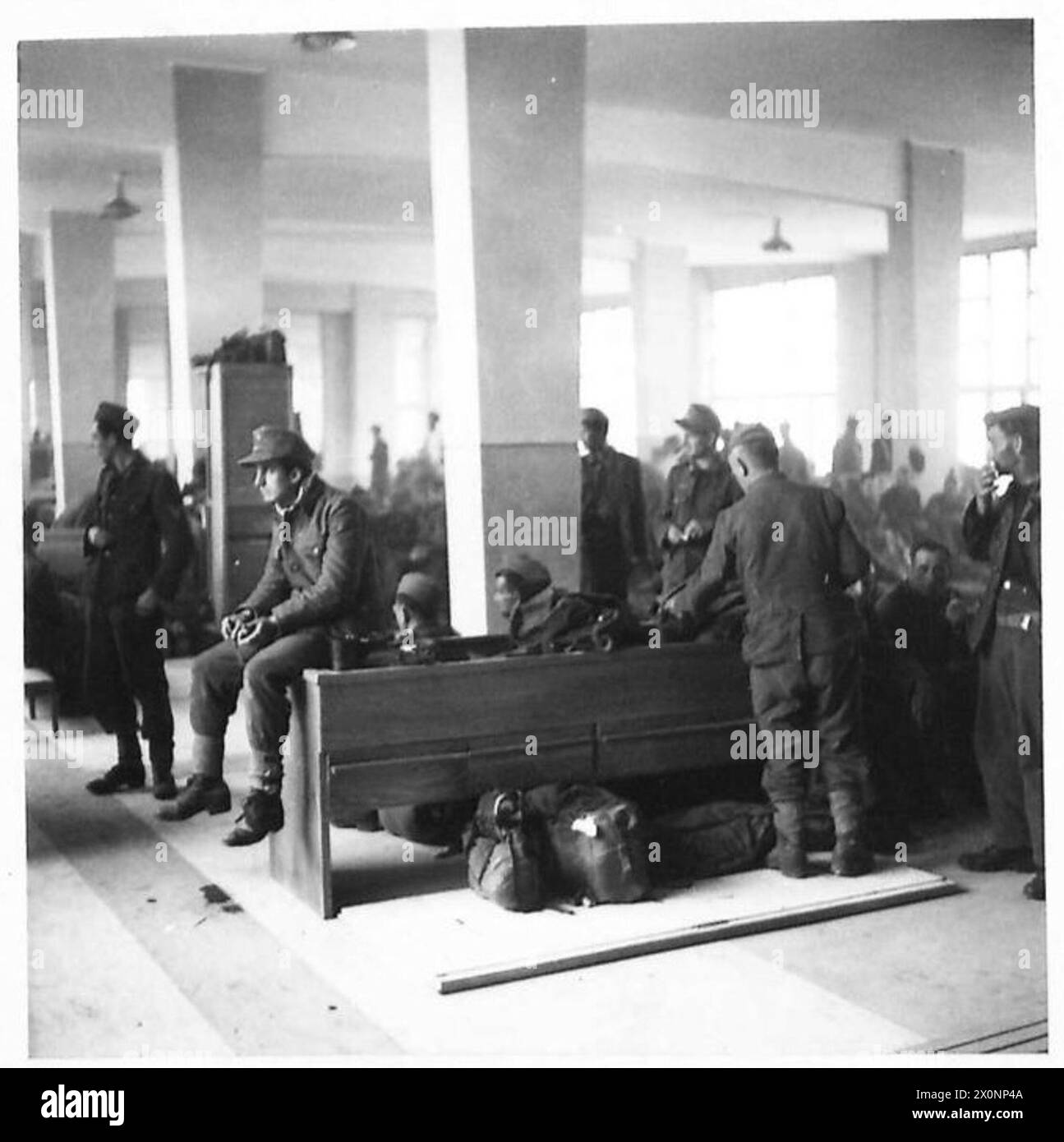 German landing force personnel are shown inside a building after ...
