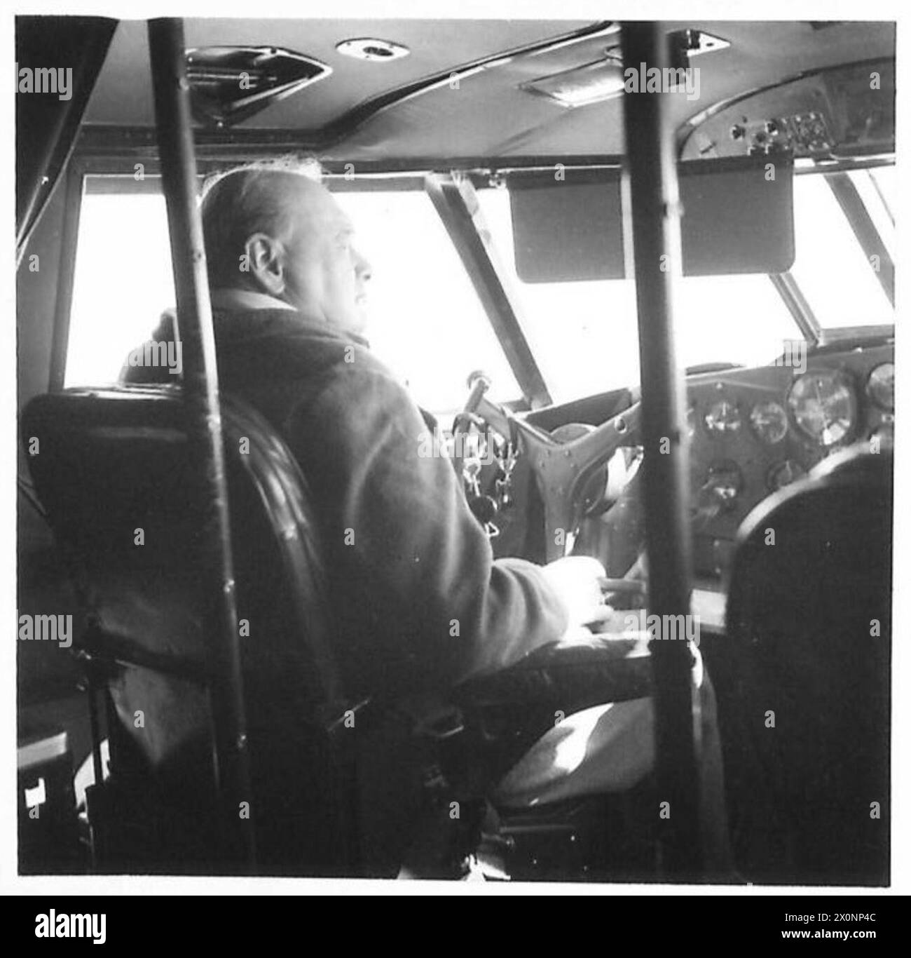 PRIME MINISTER RETURNS BY AIR - The Prime Minister seen at the controls ...