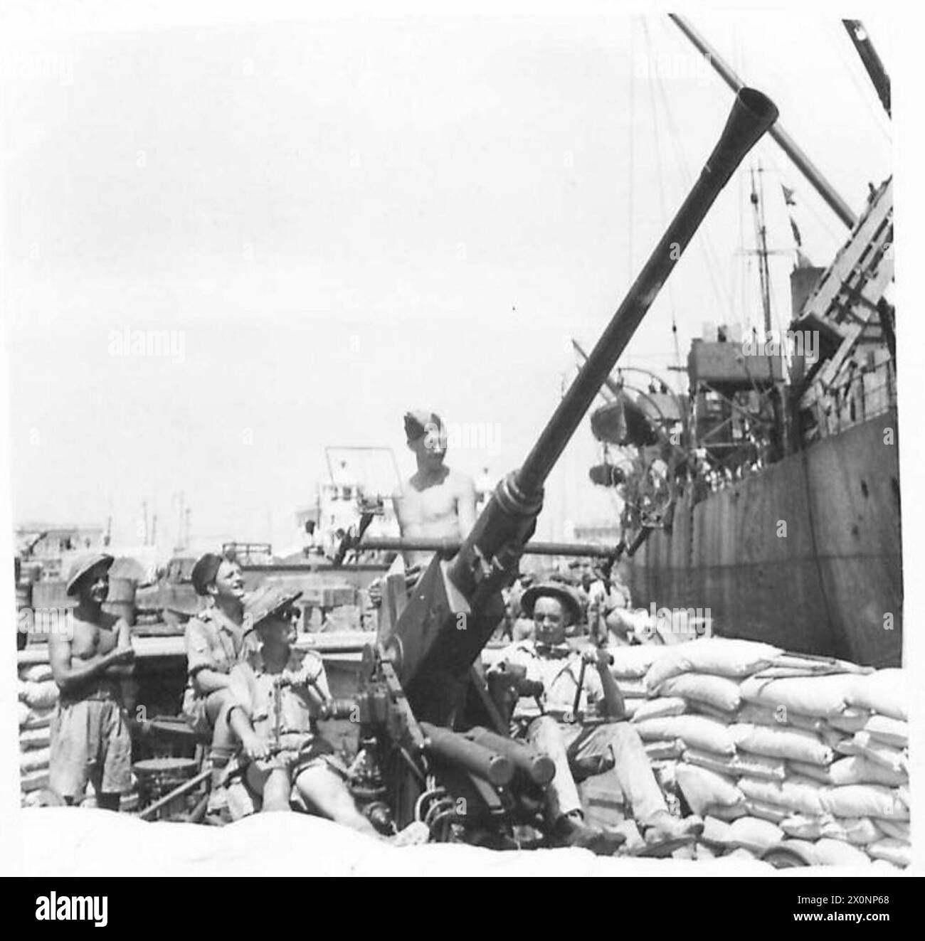 COMPO RATIONS - Men of the 66 L.A.A. Regiment guarding the docks ...
